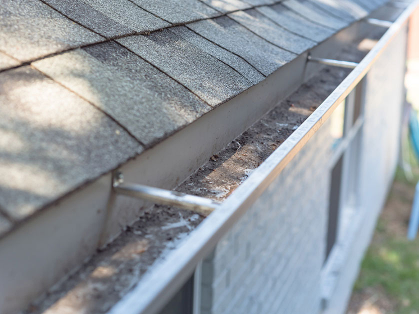 Asphalt Shingle Granules in Your Gutters: What Does It Mean?